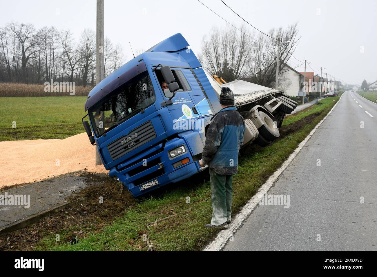 03.12.2019., Klokocevac, Croatia - Truck full of corn lies in a ditch ...
