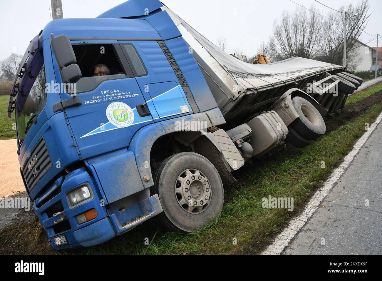 03.12.2019., Klokocevac, Croatia - Truck full of corn lies in a ditch ...