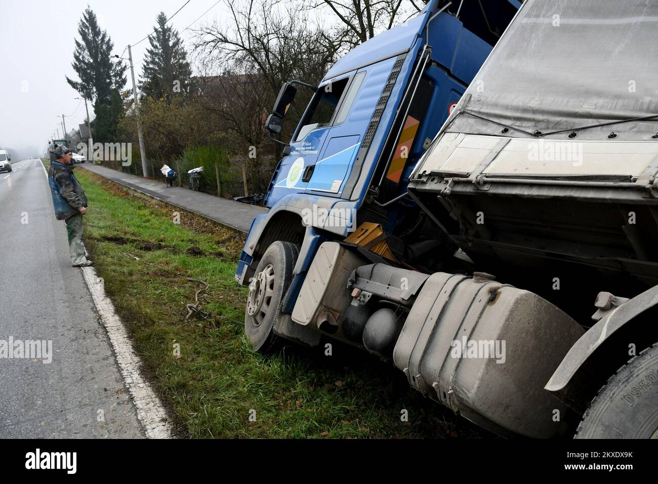 03.12.2019., Klokocevac, Croatia - Truck full of corn lies in a ditch ...