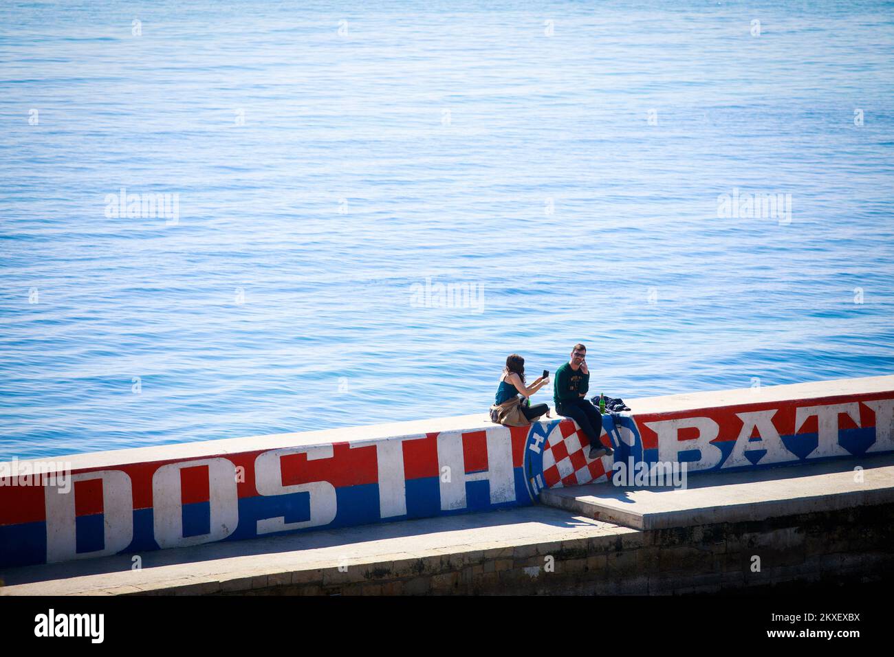 19.03.2020., Split, Croatia - People in shallow water on Firule beach ...