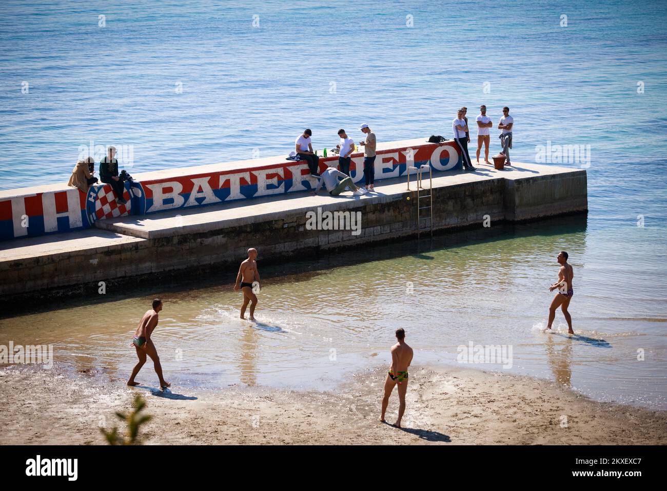 19.03.2020., Split, Croatia - People in shallow water on Firule beach ...