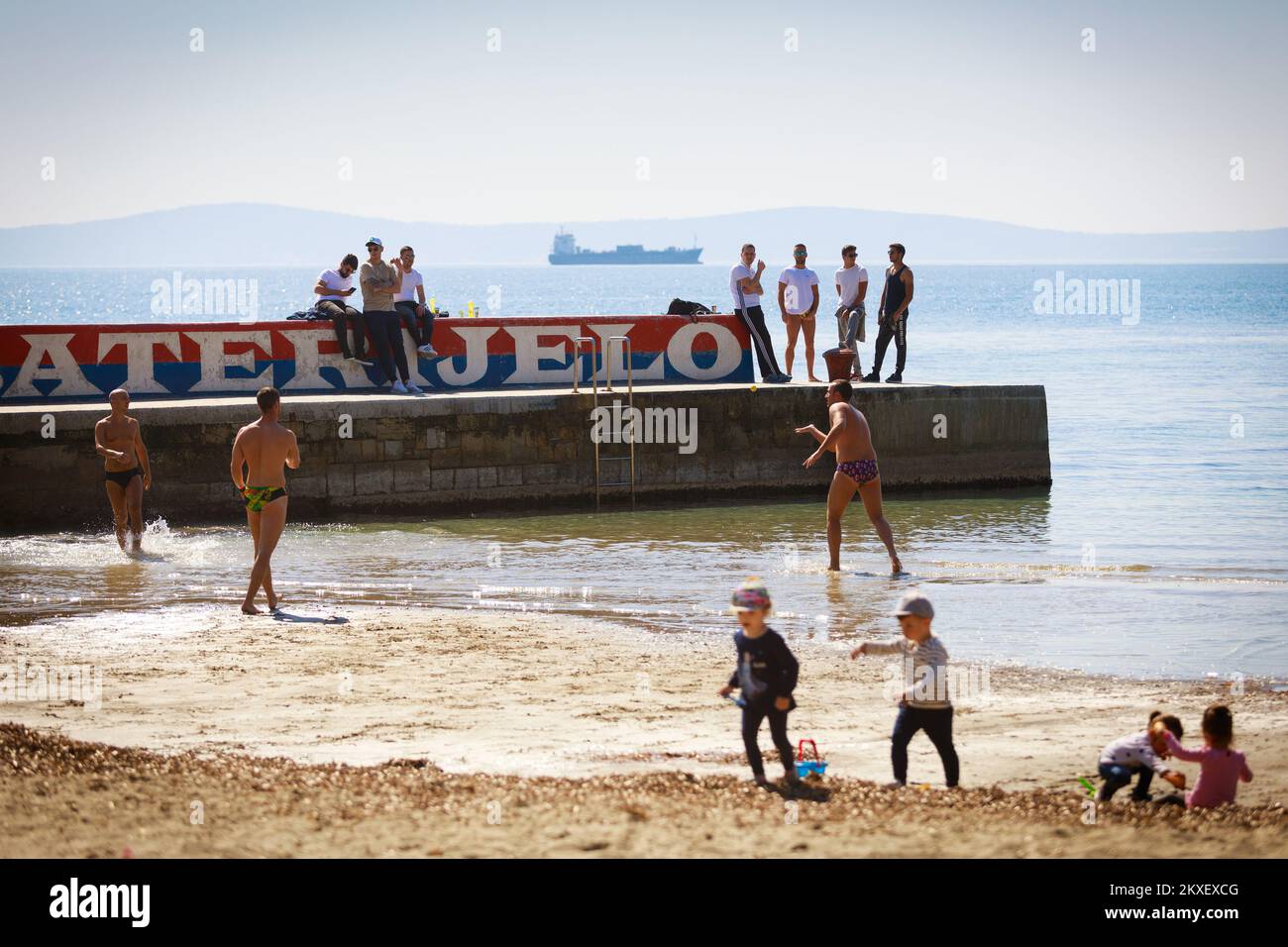 19.03.2020., Split, Croatia - People in shallow water on Firule beach ...