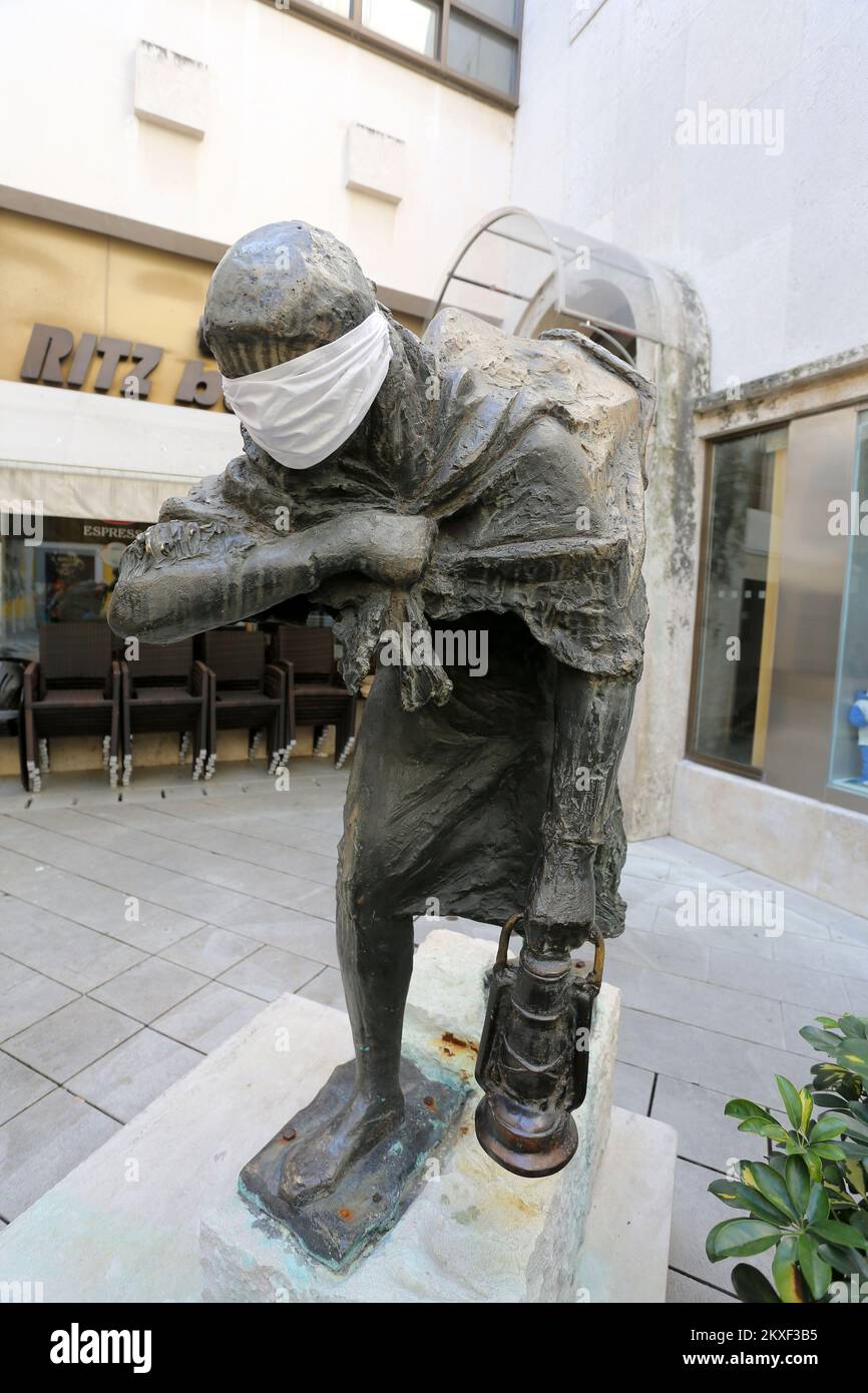 29.03.2020., Rijeka, Croatia - Sculpture of milk woman wearing safety ...