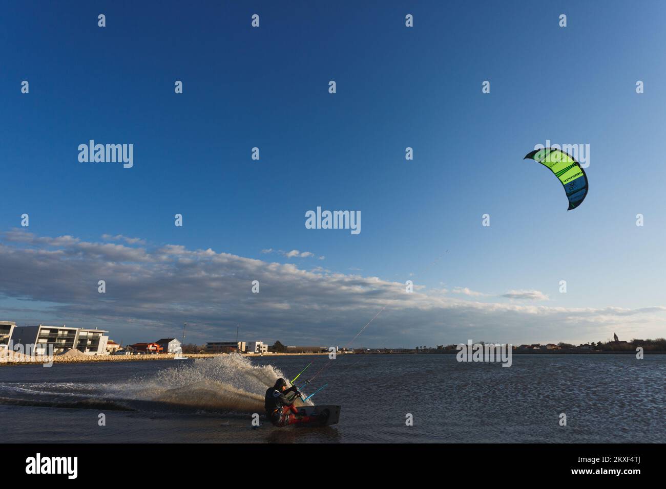 31.03.2020., Nin, Croatia - Kite surfers enjoying sunny day on the sea ...