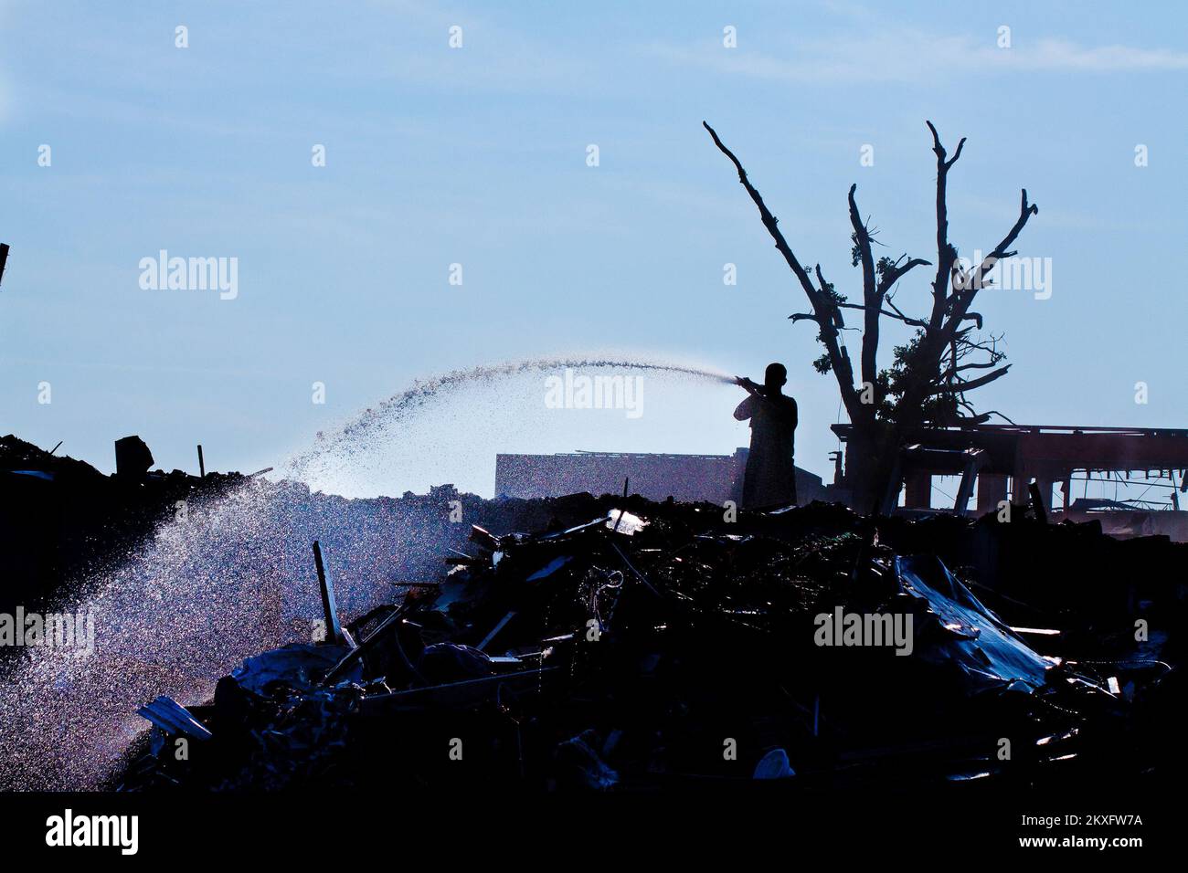 Hose Down. Missouri Severe Storms, Tornadoes, And Flooding. Photographs ...