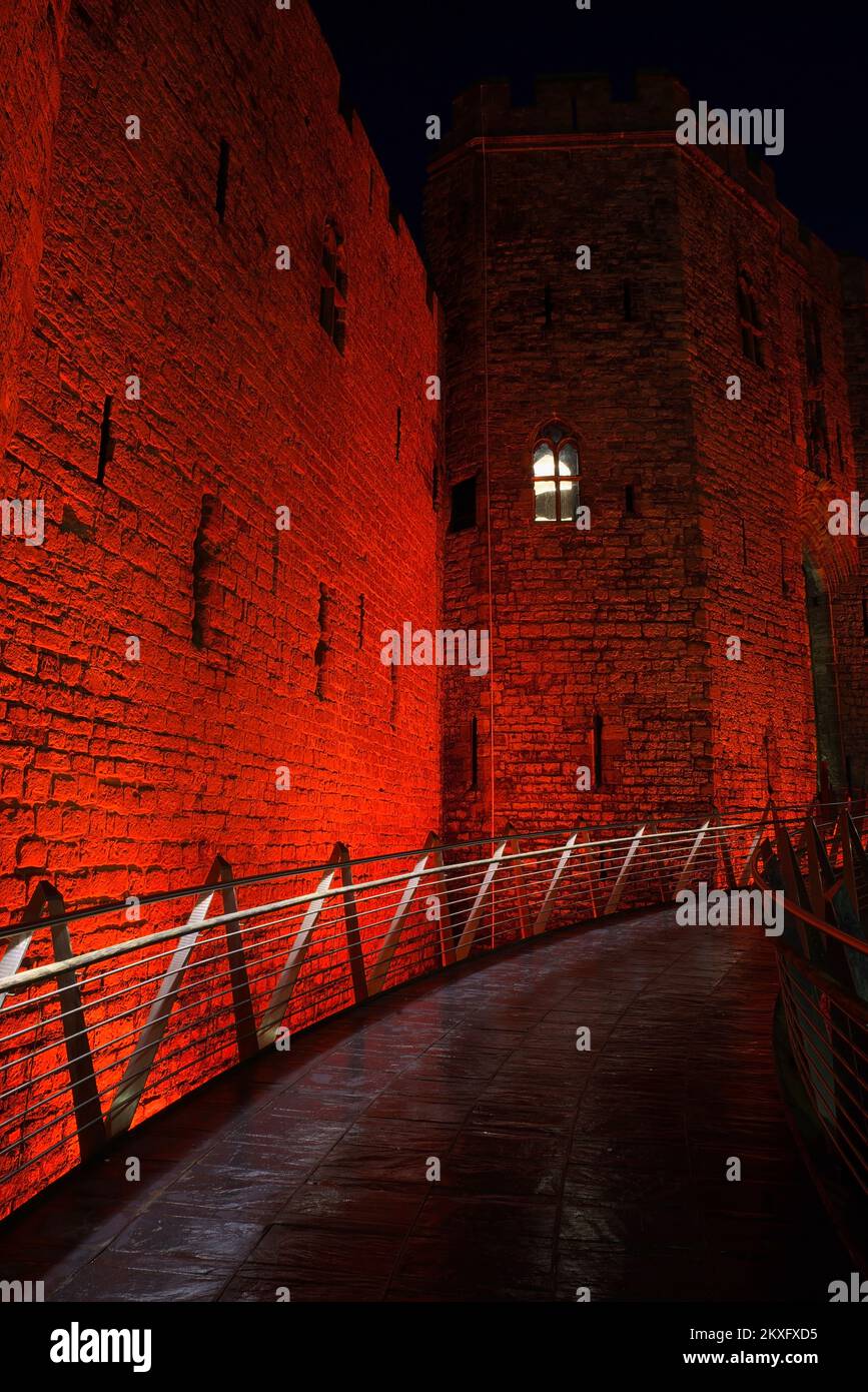 Caernarfon Castle, illuminated red to commemorate Wales Football team ...