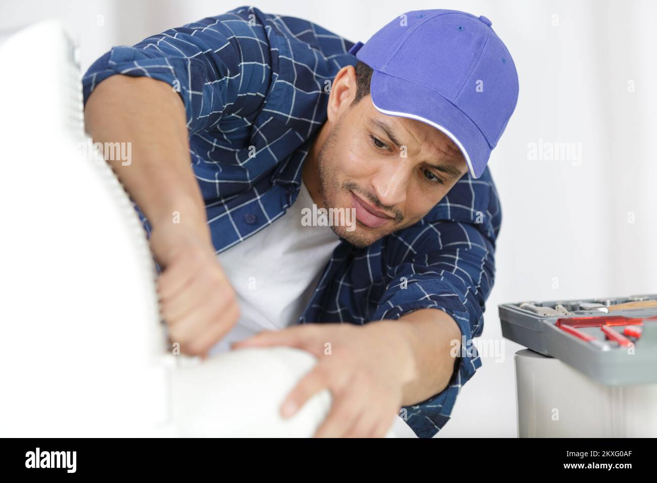 Man repair armchair hi-res stock photography and images - Alamy