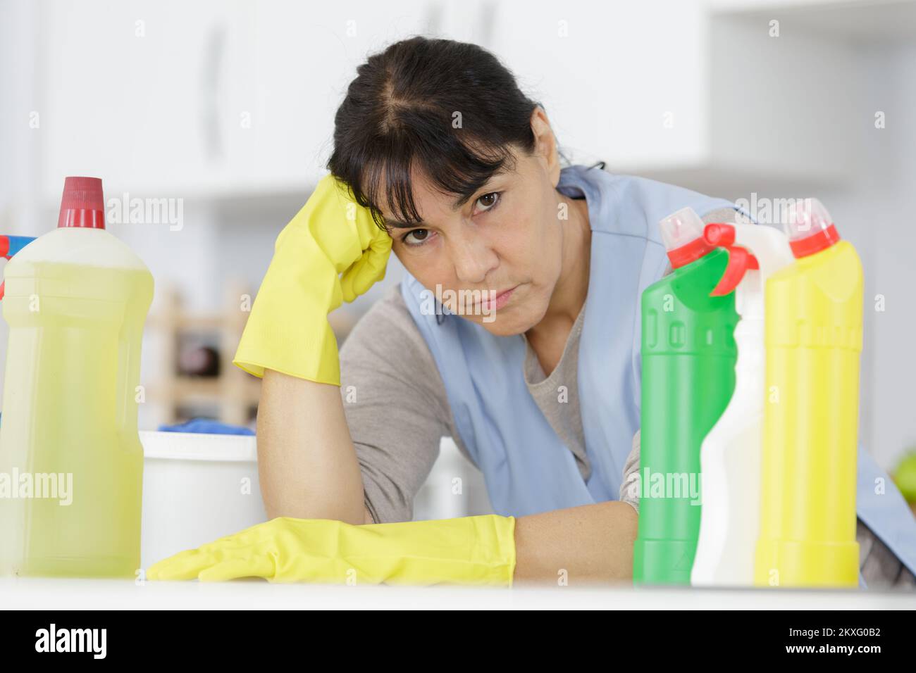 Mature woman cleaning supplies hi-res stock photography and images - Alamy