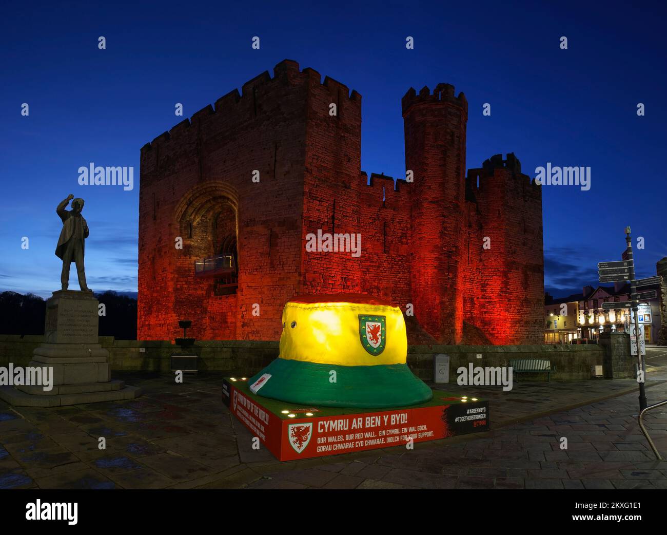 Caernarfon Castle, illuminated red to commemorate Wales Football team ...