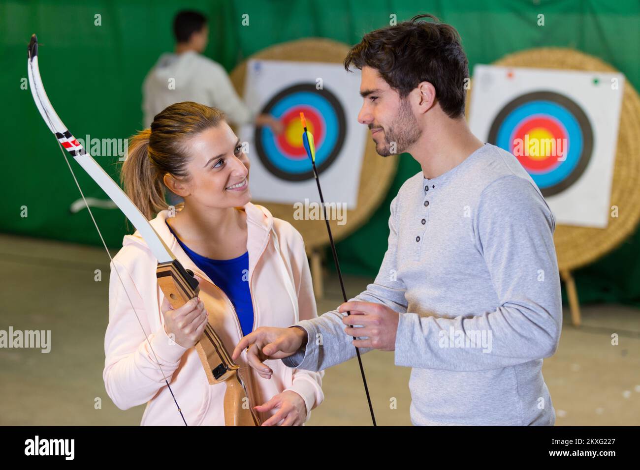 young couple at archery practice Stock Photo - Alamy