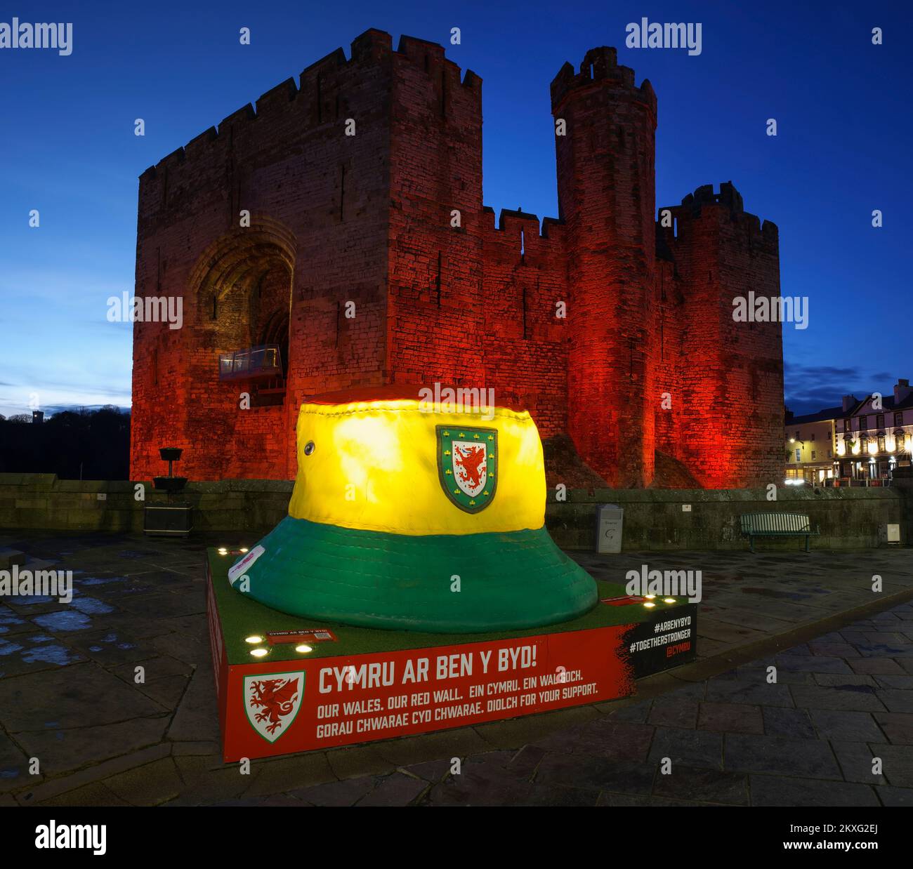 Caernarfon Castle, illuminated red to commemorate Wales Football team ...