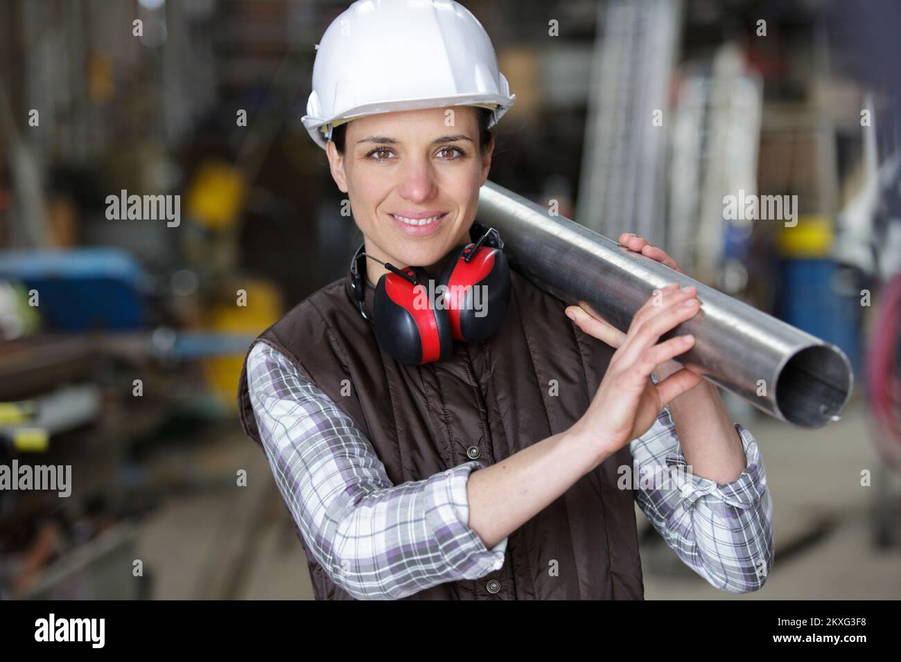 Construction worker carrying pipes hi-res stock photography and images ...