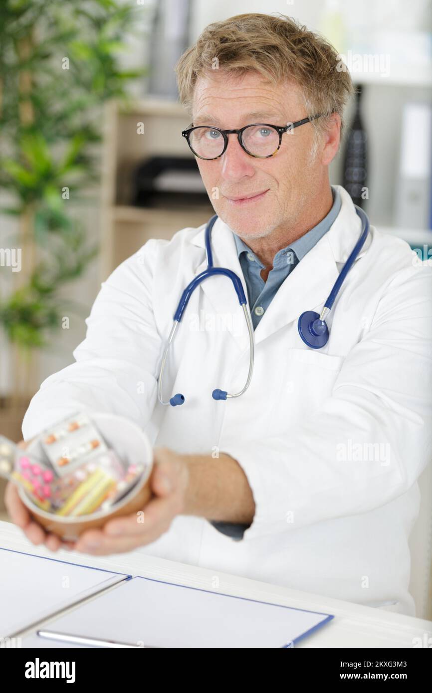 Beautiful mature doctor giving hi-res stock photography and images - Alamy