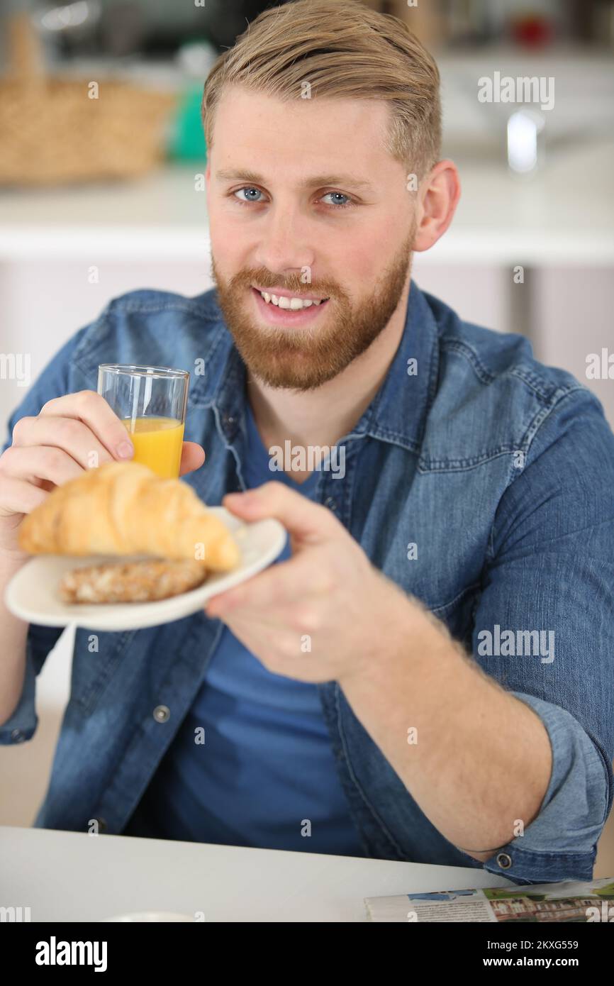 a man eating a healthy morning meal Stock Photo - Alamy