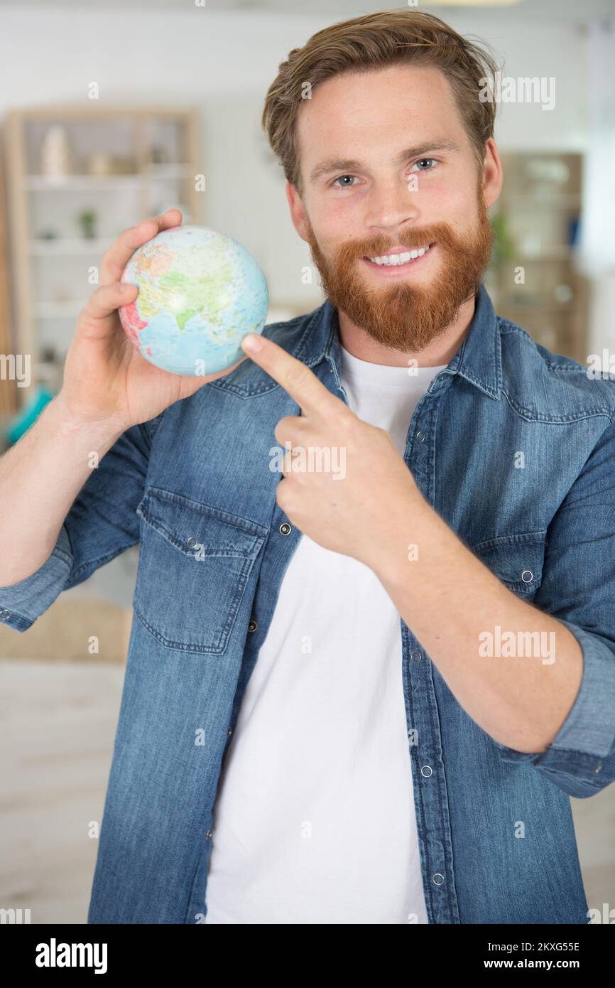 Young man smiling pointing enthusiasm hi-res stock photography and ...