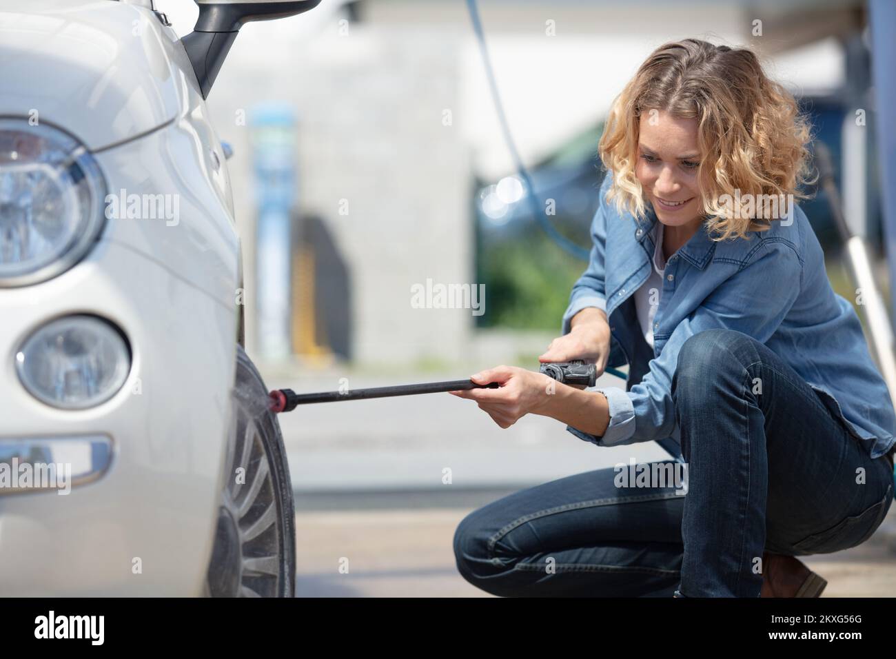Holding high pressure cleaner hi-res stock photography and images - Alamy