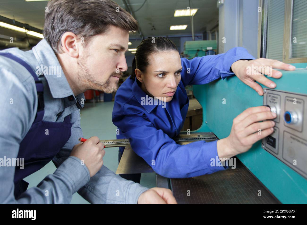 portrait of two factory workers at work Stock Photo - Alamy
