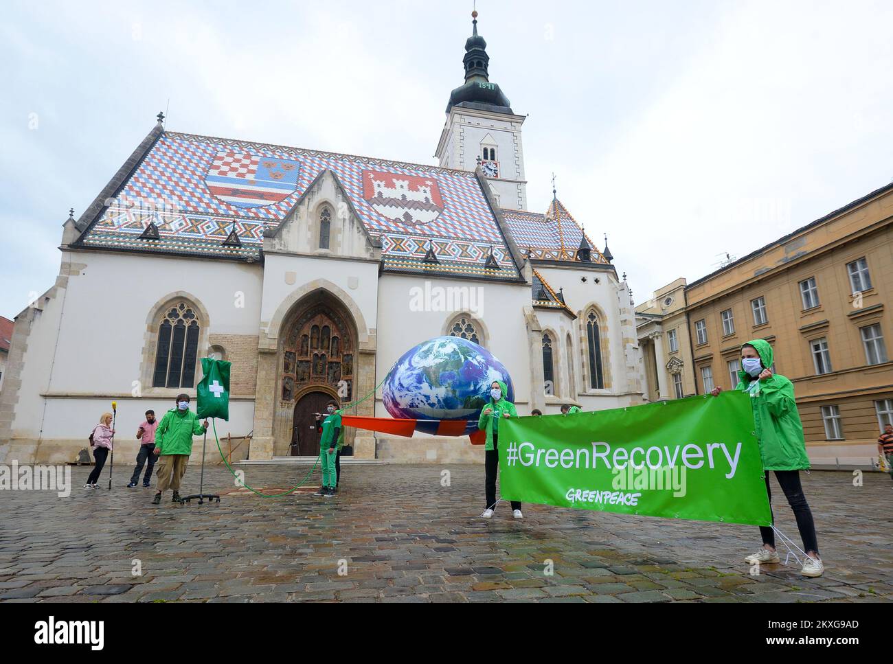 09.06.2020., Zagreb - Greenpeace activists carry a giant globe attached ...