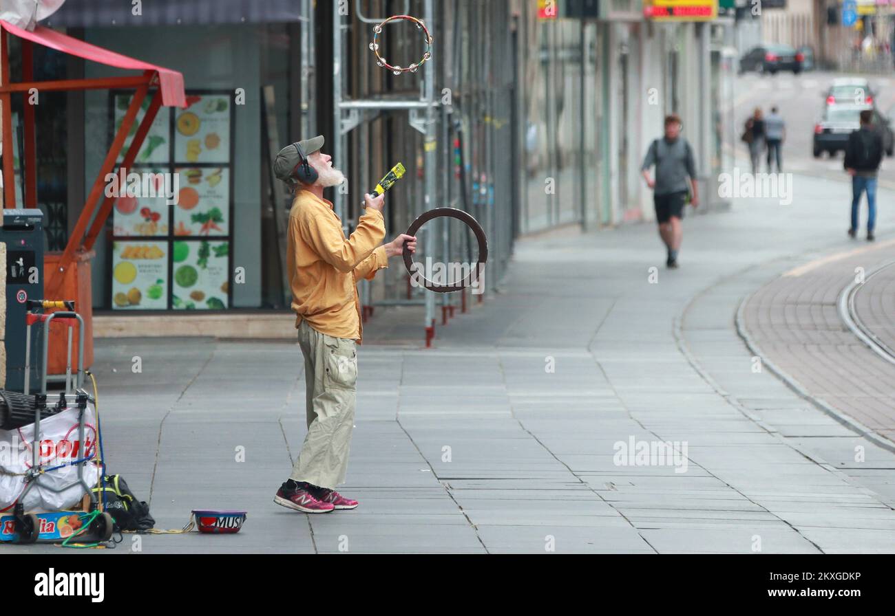 Juggler is seen juggling with plush toys and some improvised music ...