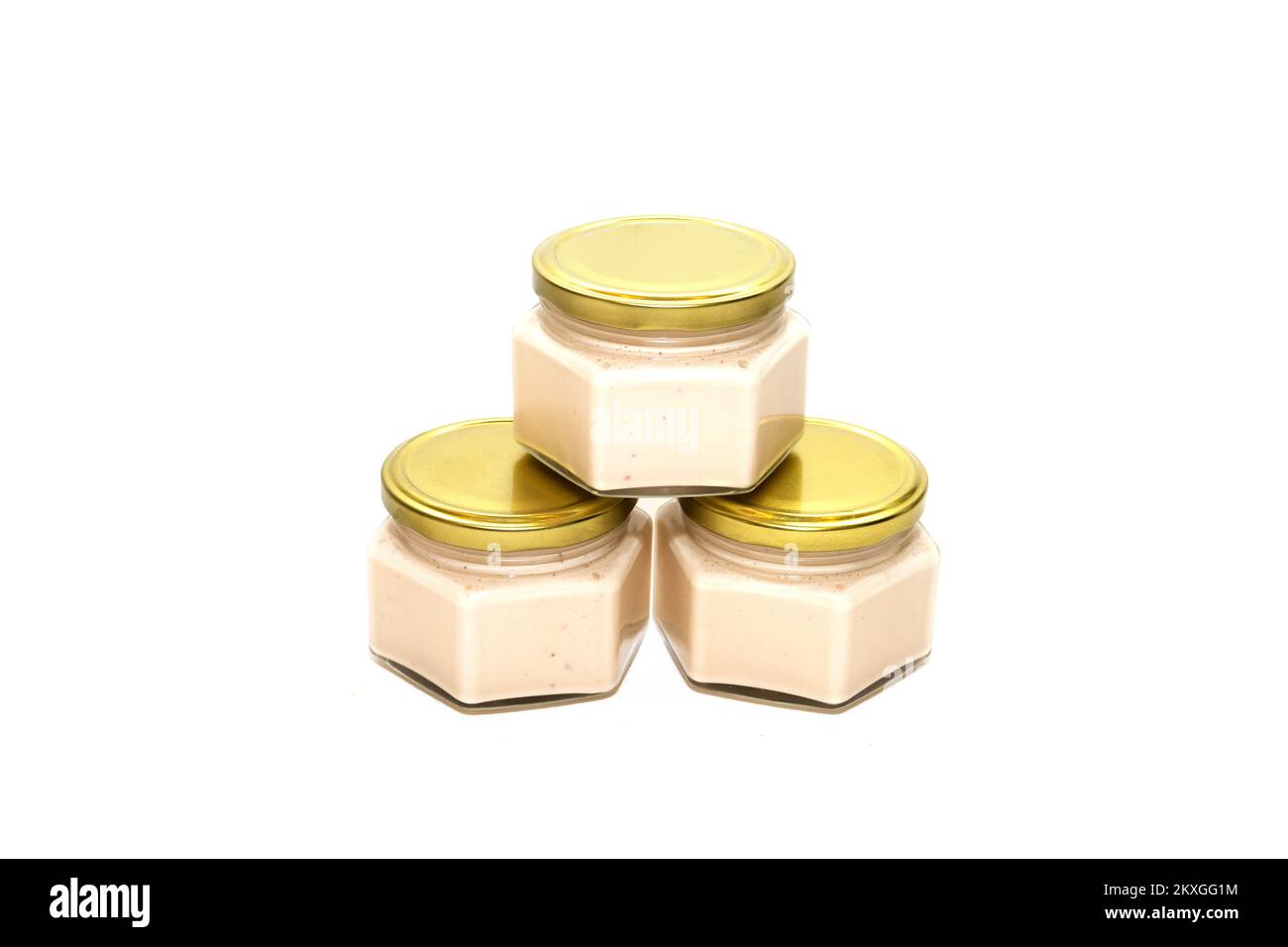 Three glass jars with jam on a white background Stock Photo - Alamy