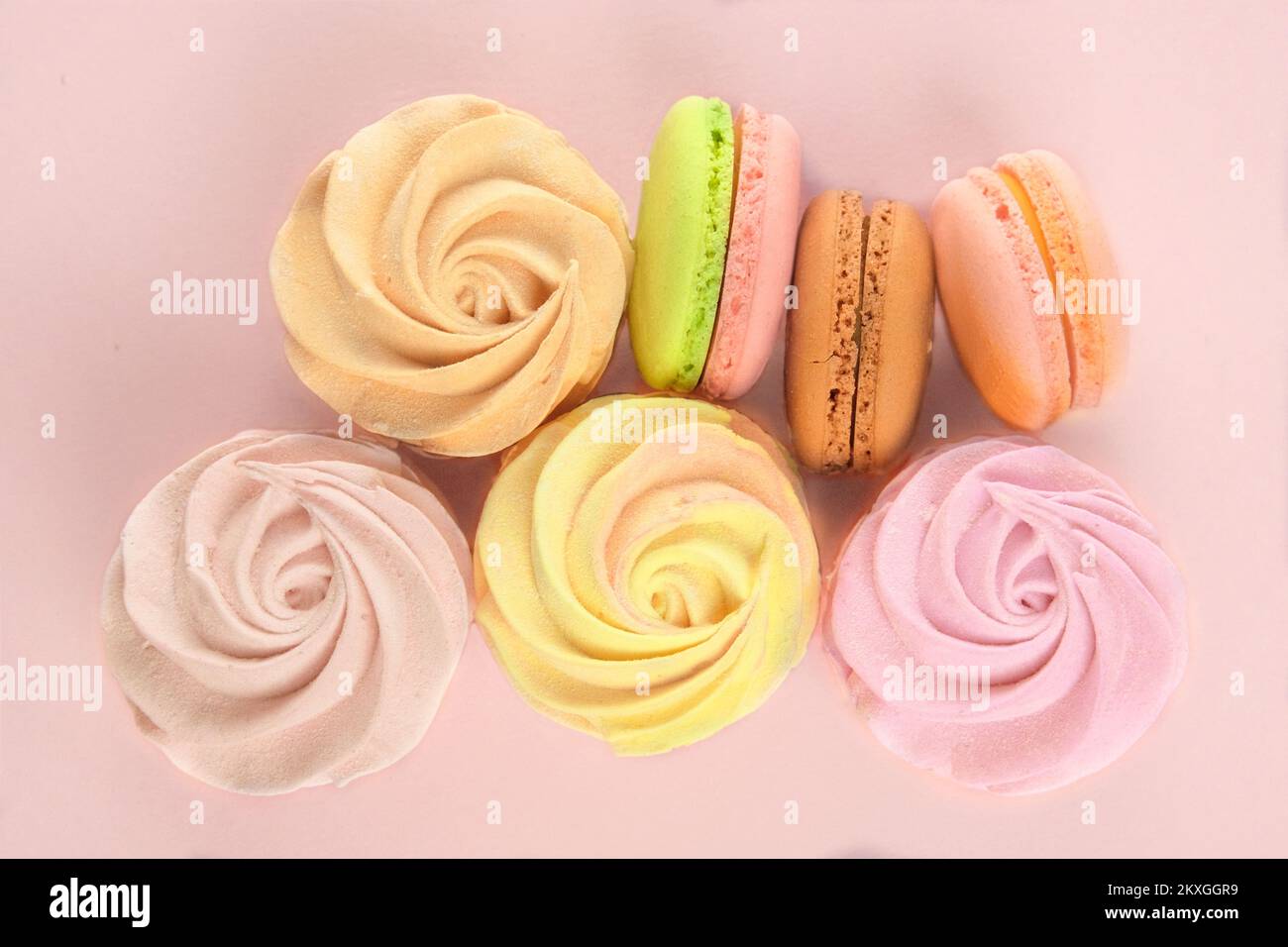 Sweet desserts for the holiday. Desserts: macaroons, marshmallows and ...