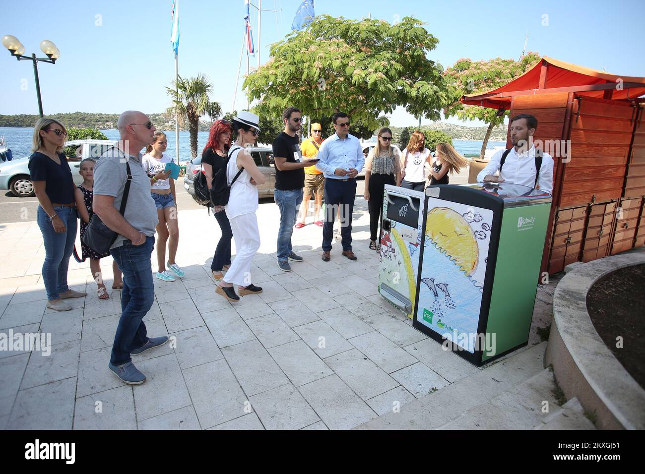 Three Big Belly Solar Compactor waste and recycling bins set up on ...