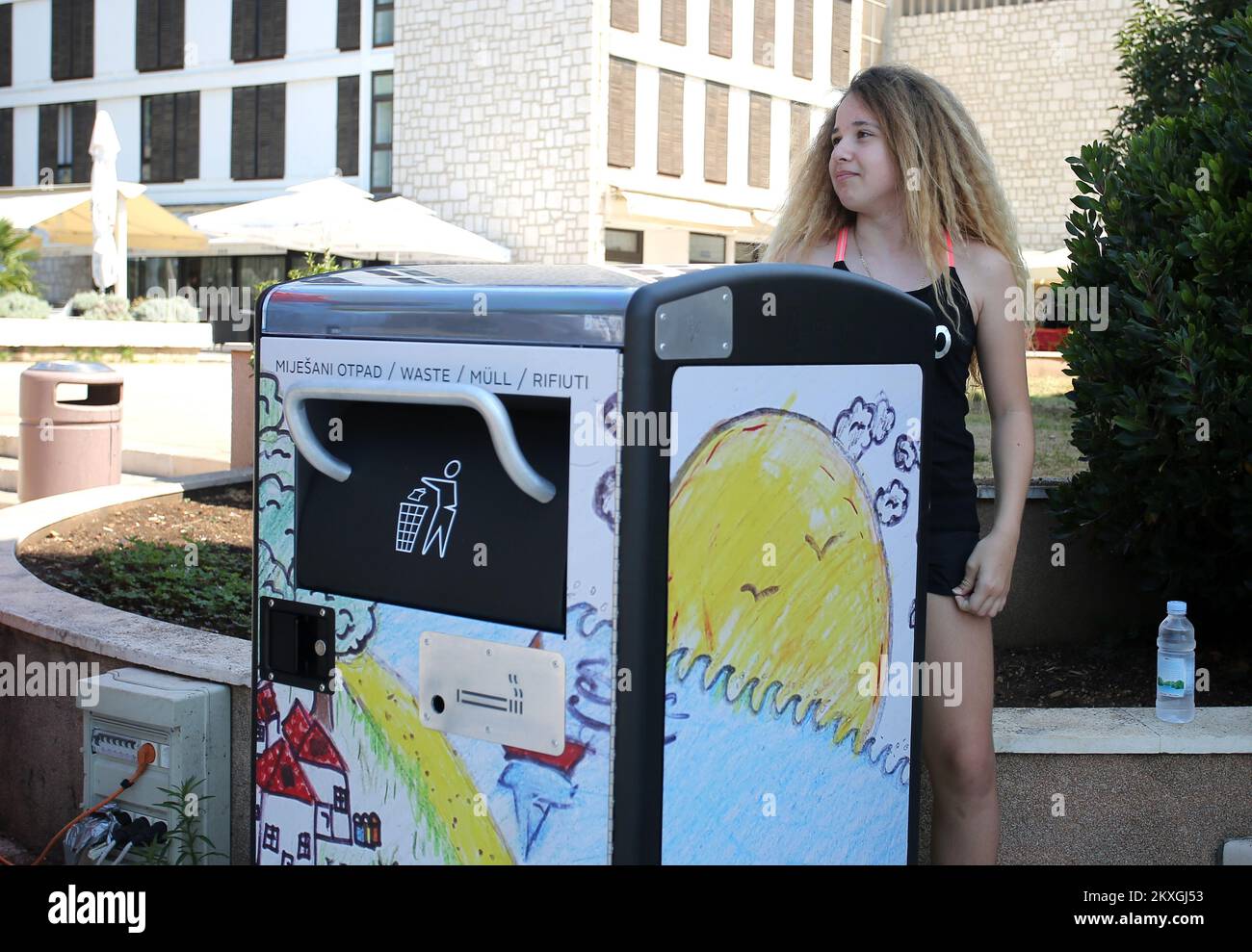 Three Big Belly Solar Compactor waste and recycling bins set up on ...