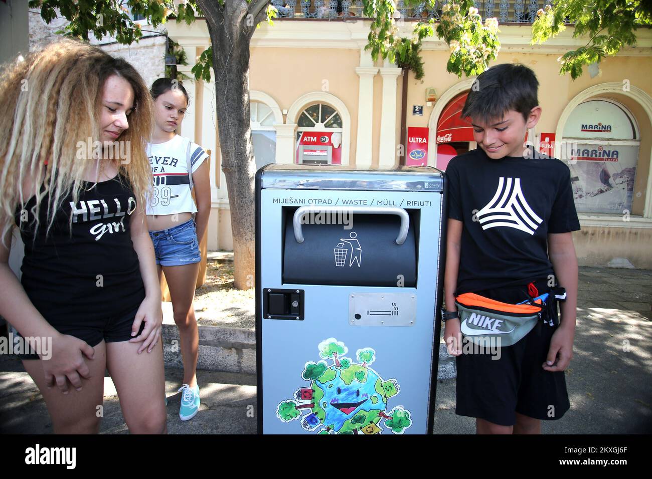 Three Big Belly Solar Compactor waste and recycling bins set up on ...