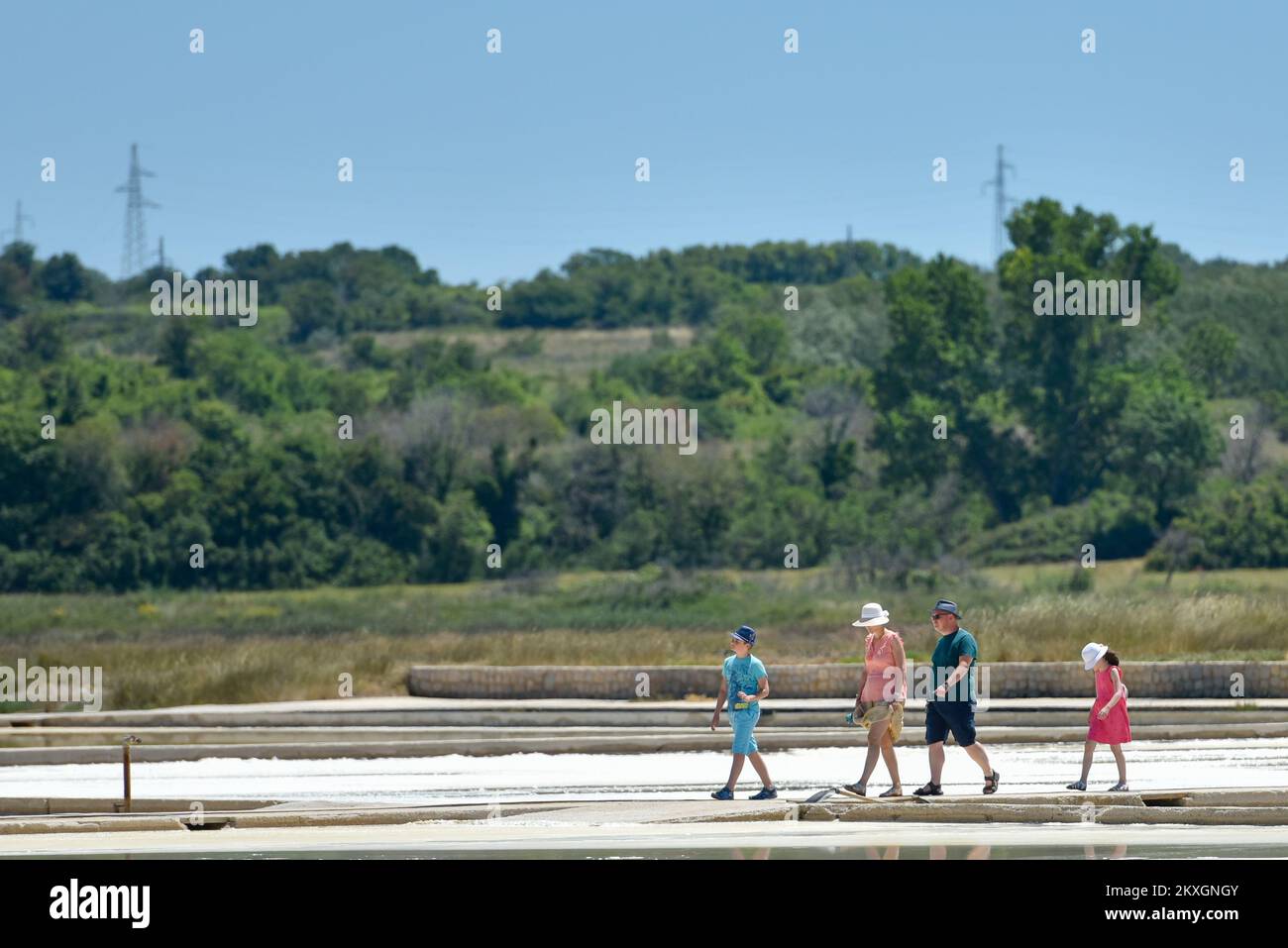 People visit Nin Saltworks in Nin, Croatia, on July 9, 2020. The ...