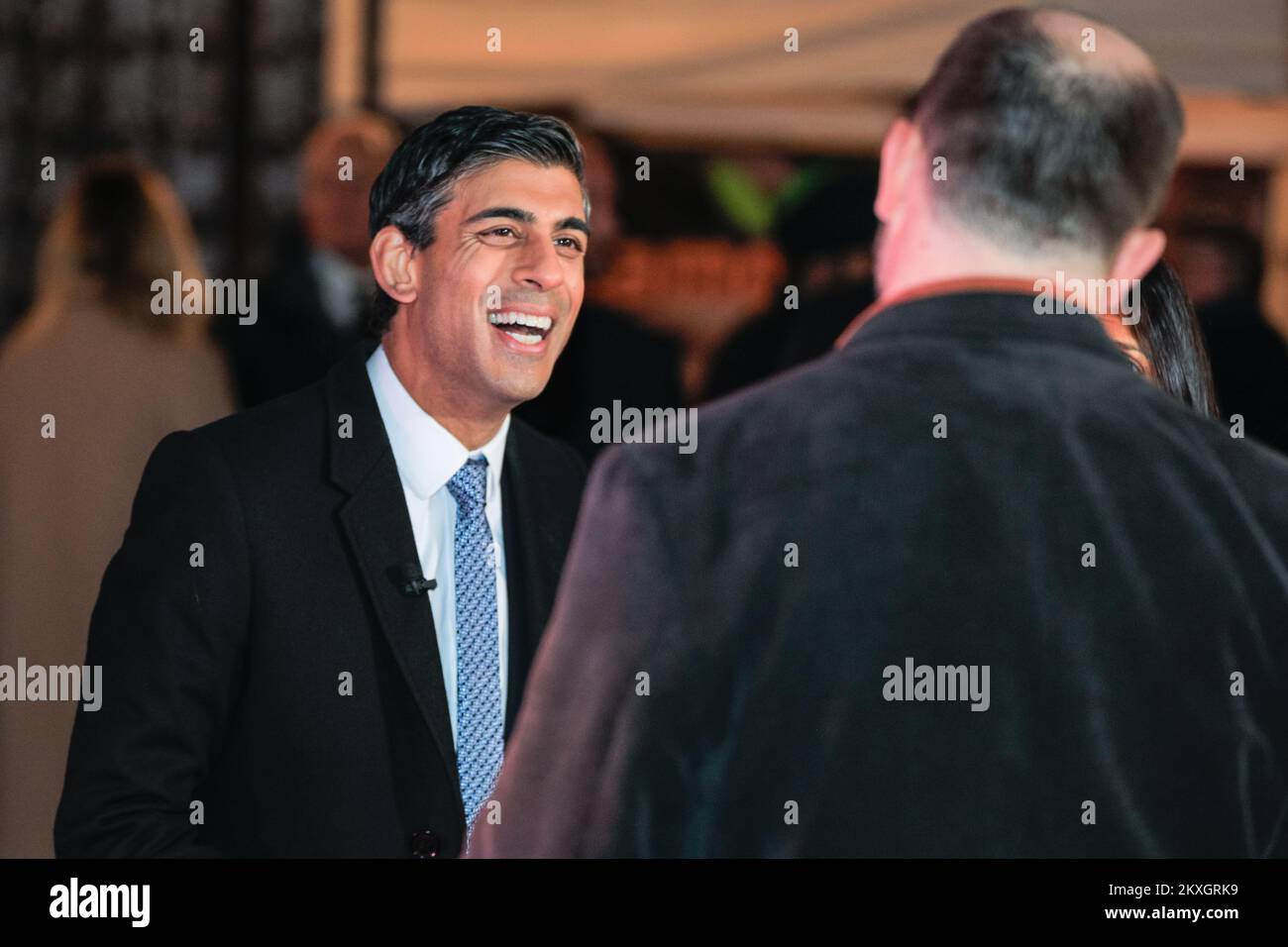 London, UK. 30th Nov, 2022. The Sunaks chat to traders at Neary Nogs ...
