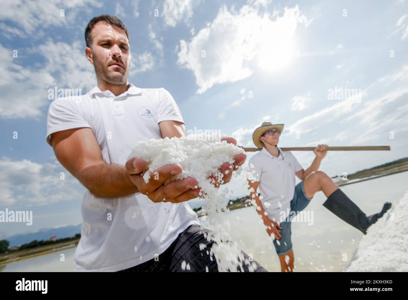 Salt harvesting at the Nin Saltworks. The natural Nin salt is a gift of ...