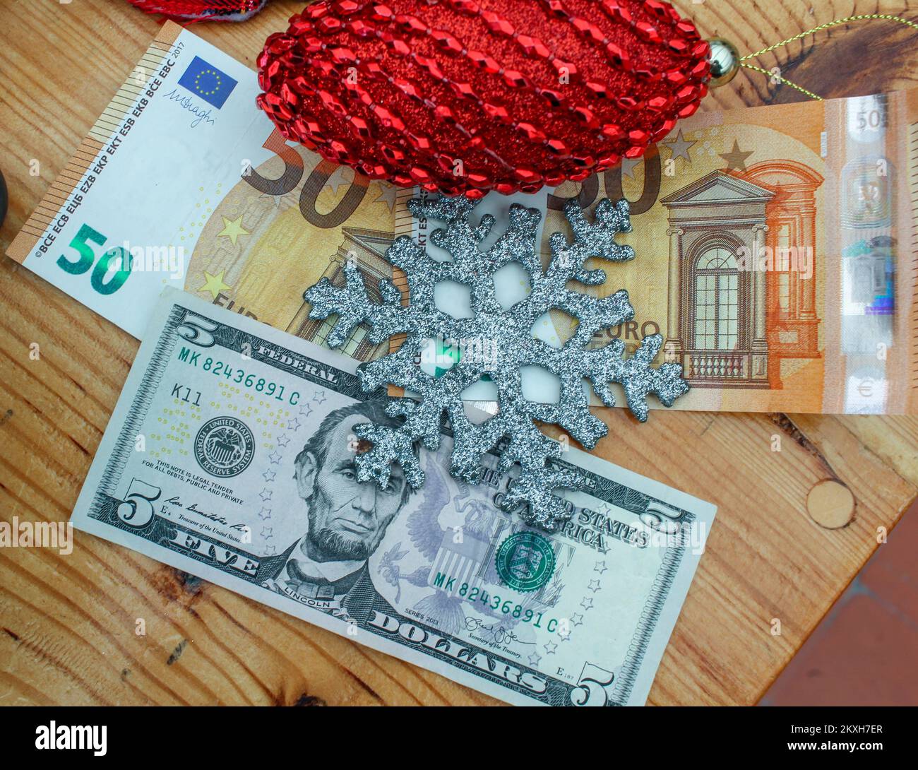 dollar and euro notes in Christmas with inflation Stock Photo - Alamy