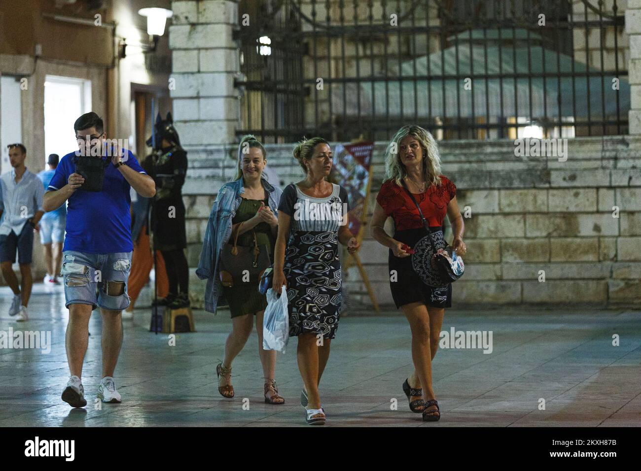 Tourist enjoy night walk in city center of Zadar, Croatia on 18. August, 2020. Photo: Marko ...