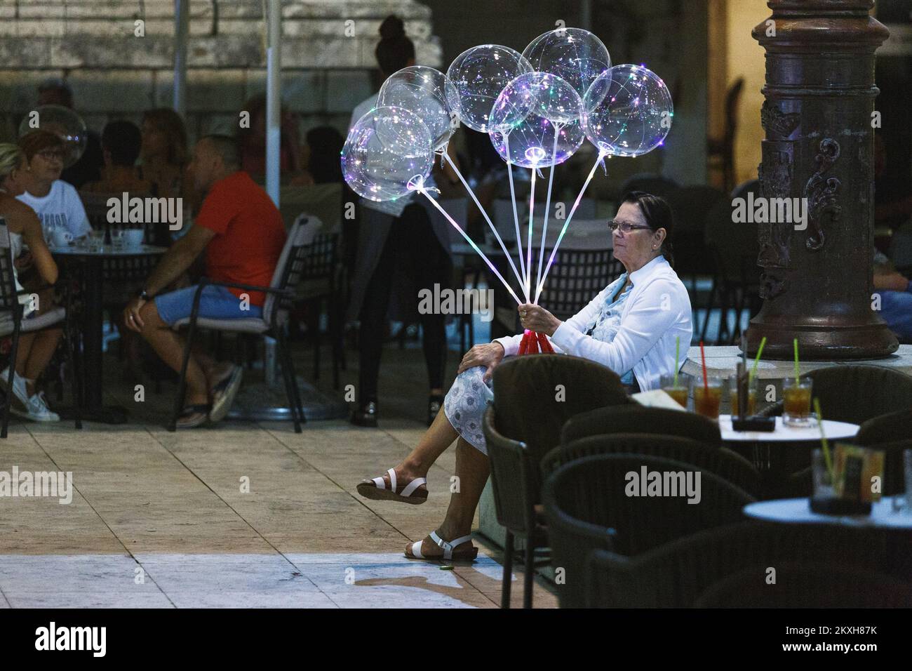 Tourist enjoy night walk in city center of Zadar, Croatia on 18. August, 2020. Photo: Marko ...