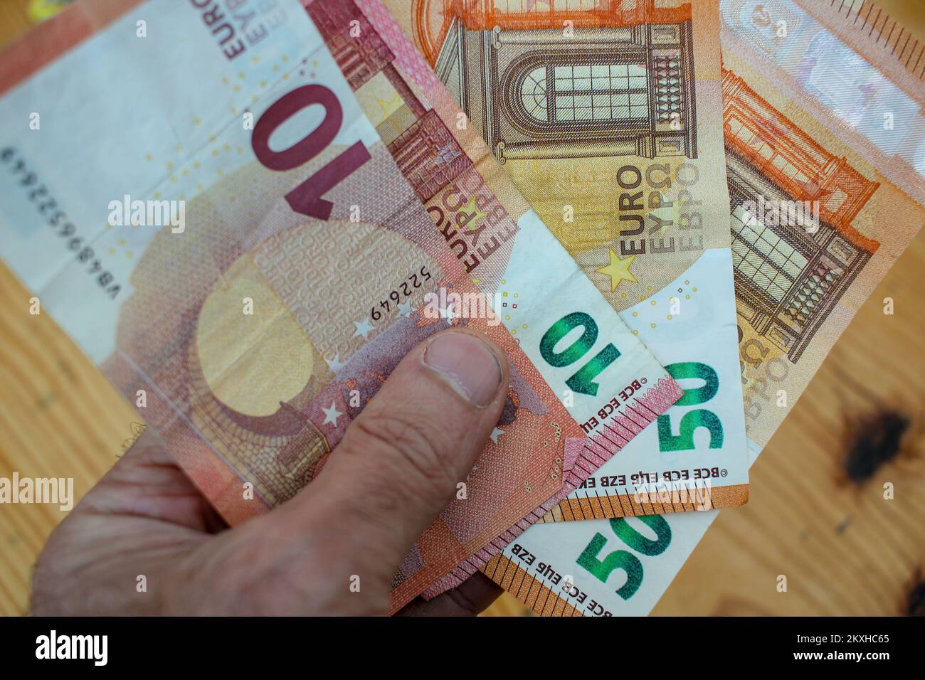 Hand euro bills hi-res stock photography and images - Alamy