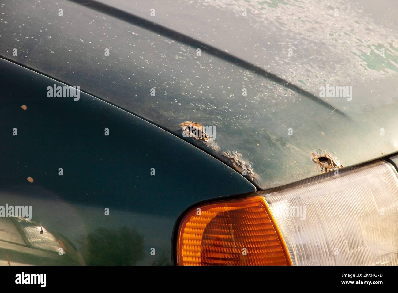 Rust and holes on the hood of the car close up Stock Photo - Alamy