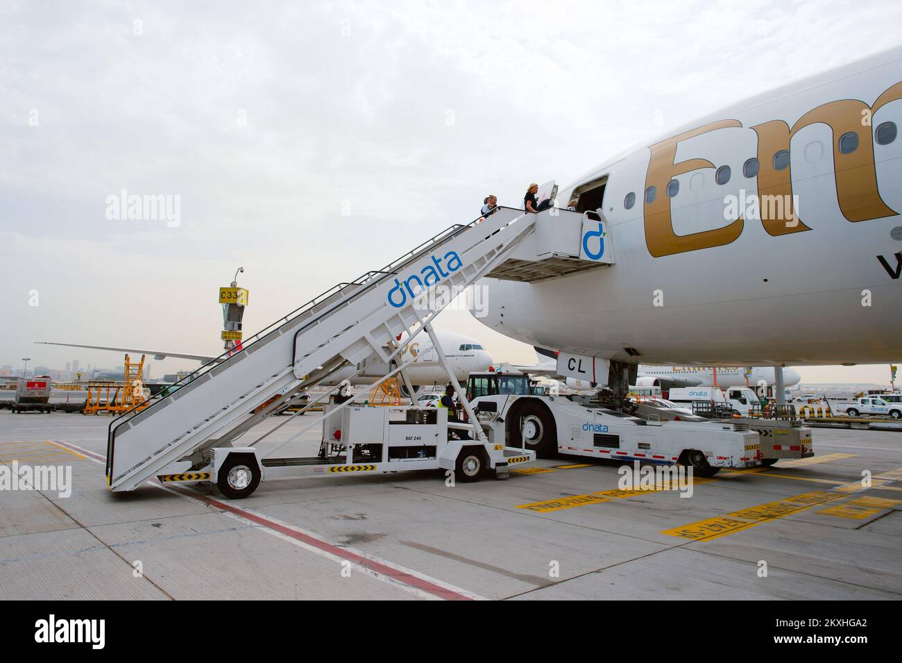 DUBAI, UAE - JUNE 23, 2015: passengers boarding the Emirates Boeing 777 ...