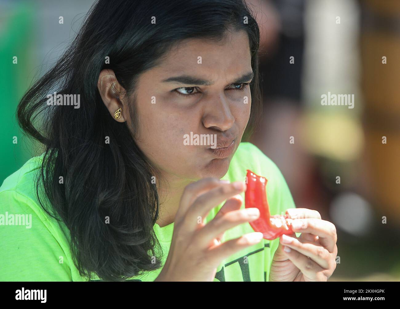 Chilli eating contestant hi-res stock photography and images - Alamy