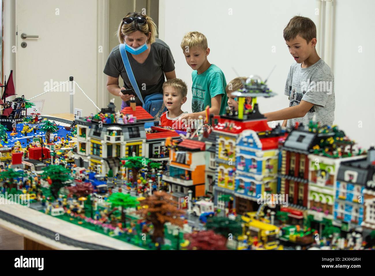 People watch the exhibits during a LEGO exhibition in Djakovo, Croatia ...