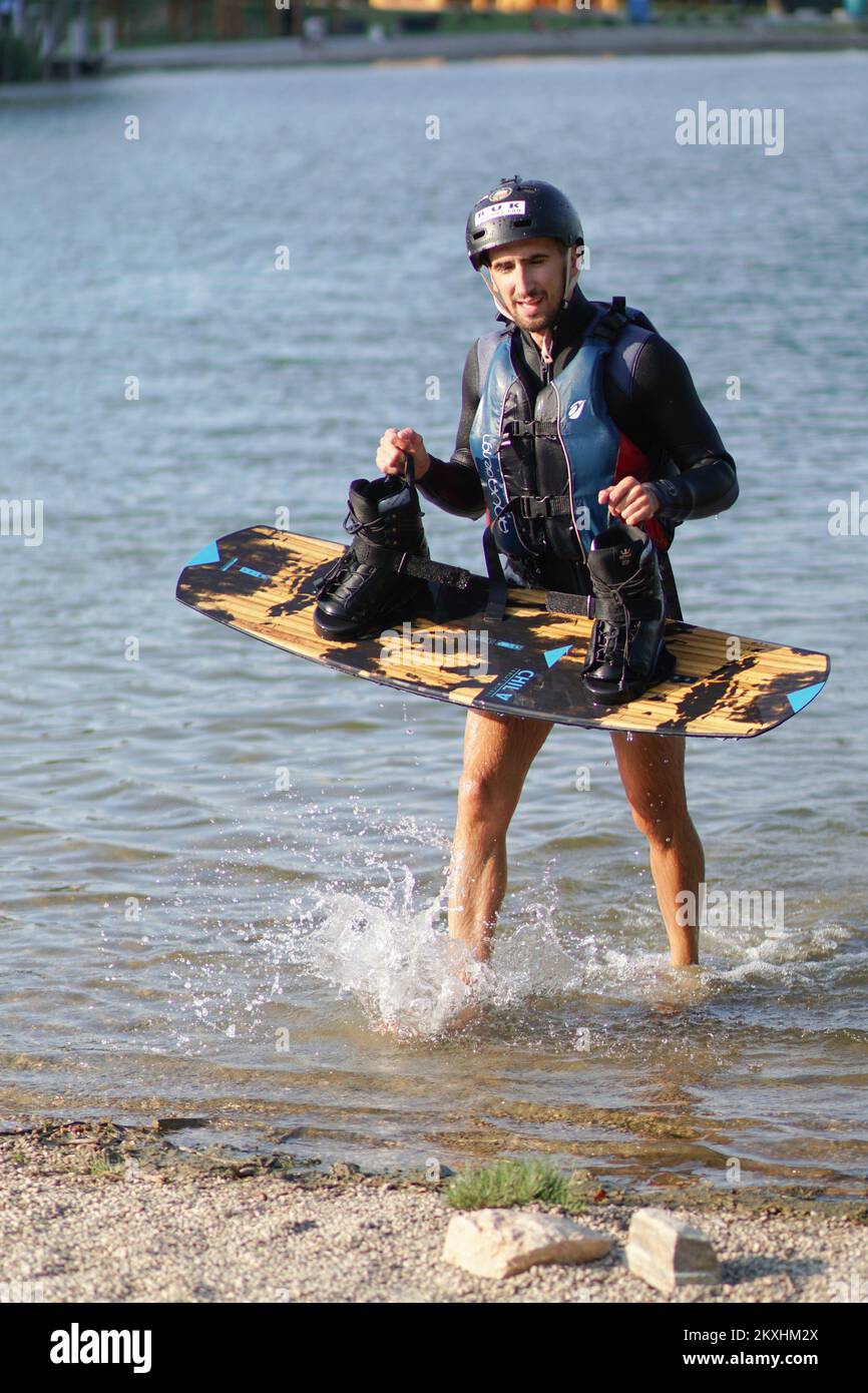 A man seen coming out of Lake Manjaca with a wakeboard at the Manjaca ...
