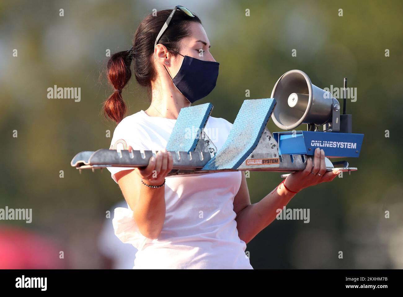 Staff member is pictured as she wear medical face mask during IAAF ...