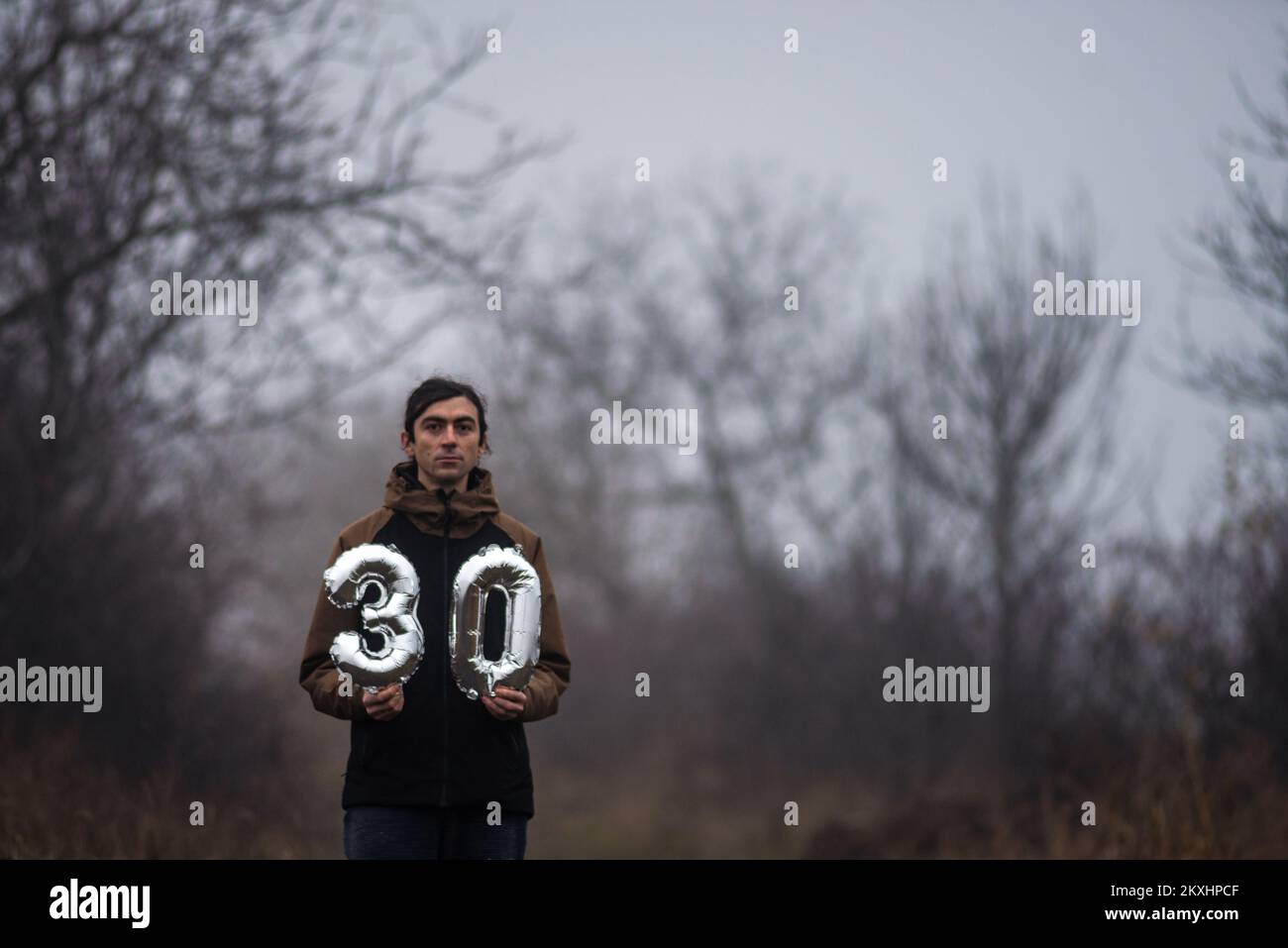 Cute guy celebrating 30th birthday man anniversary sad Adult helium ...