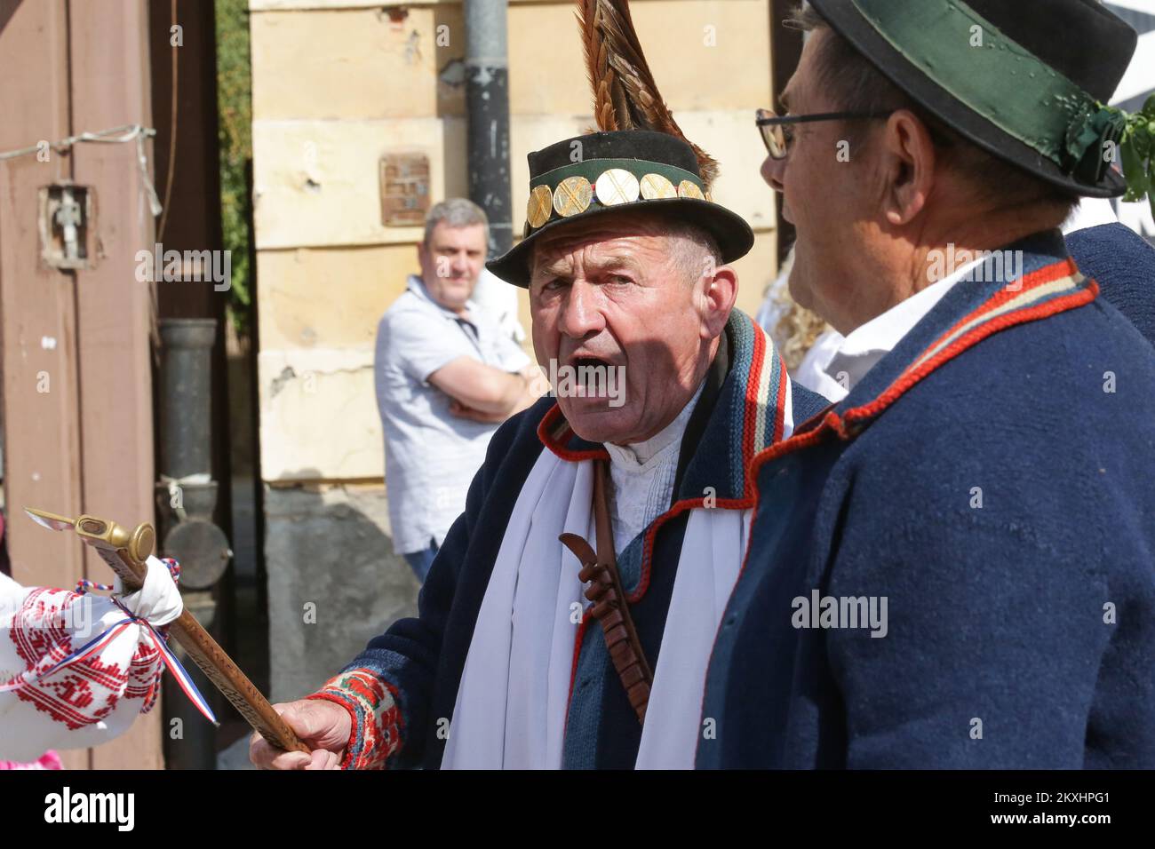 Participants dressed in traditional folk costumes during the parade of ...