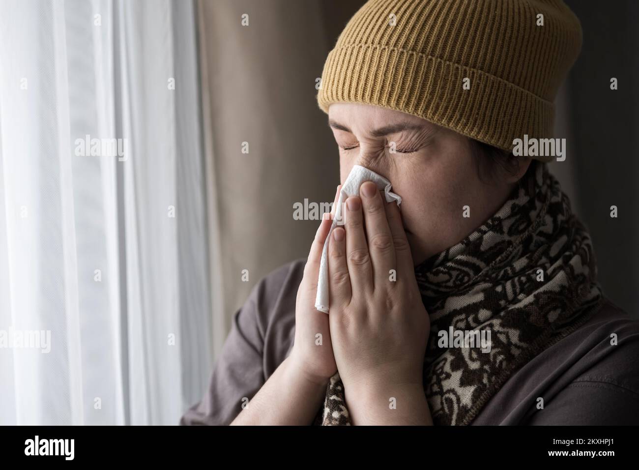 Cover nose with scarf hi-res stock photography and images - Alamy