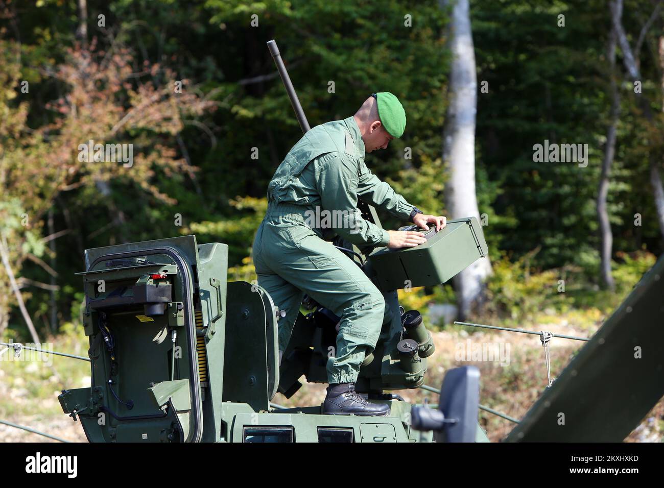Serviceman of the BOV Patria CRO 30 L armored combat vehicle give an ...