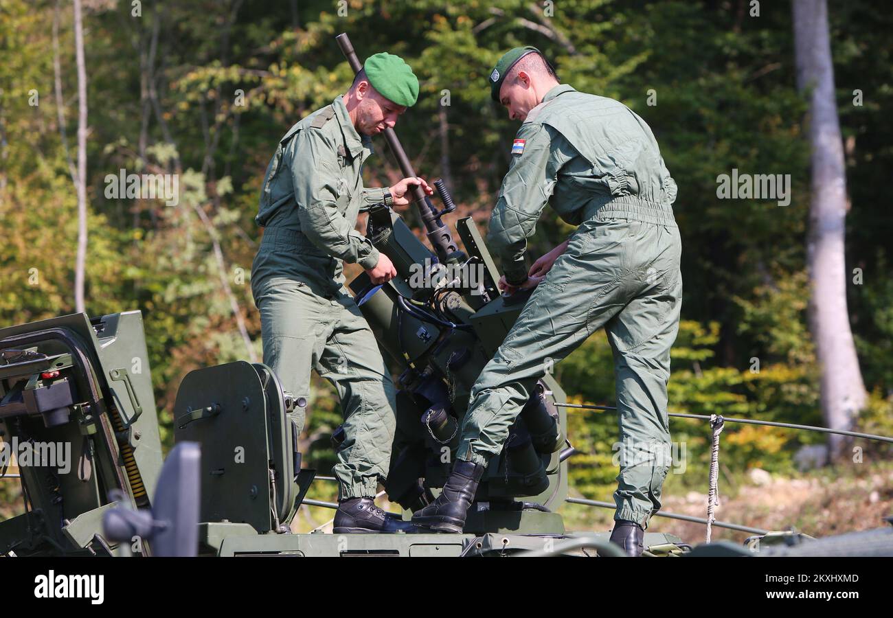 Servicemen of the BOV Patria CRO 30 L armored combat vehicle give an ...