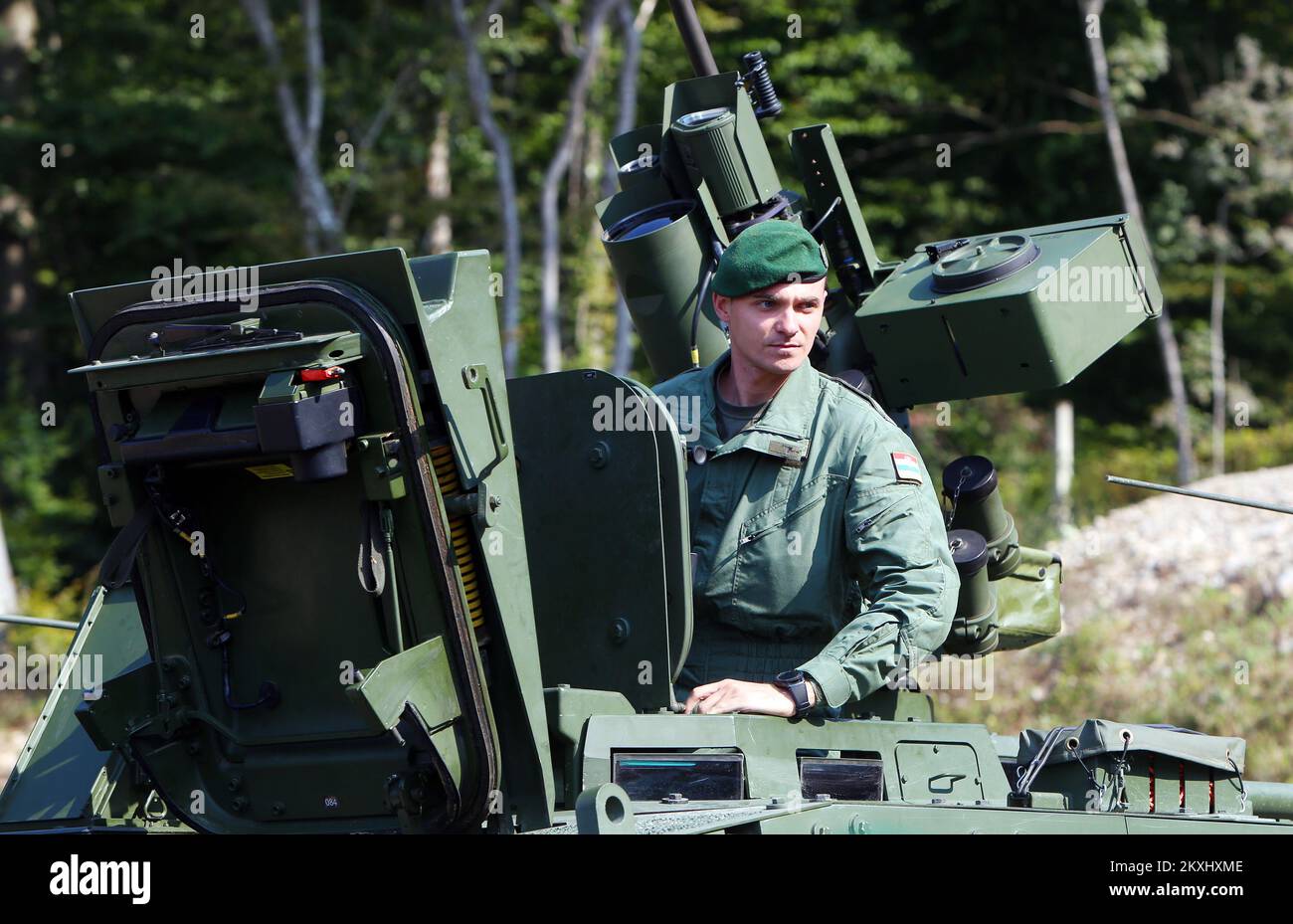 Serviceman of the BOV Patria CRO 30 L armored combat vehicle give an ...