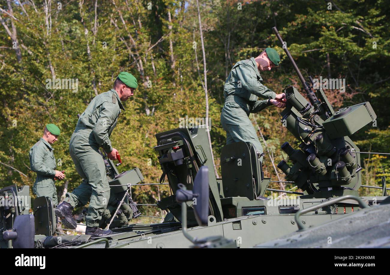 Servicemen of the BOV Patria CRO 30 L armored combat vehicle give an ...