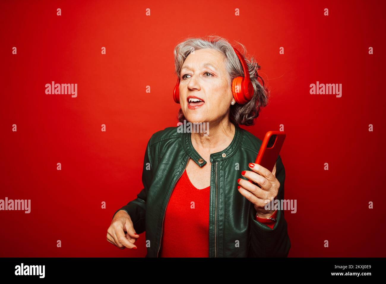 Woman wearing grey jacket hi-res stock photography and images - Alamy