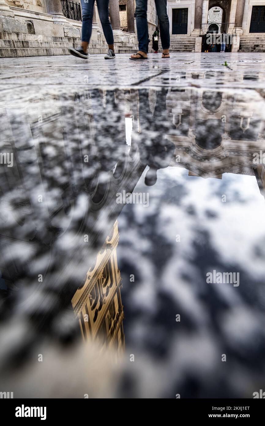 The sun shone on the streets of the city after all-day rain and autumn ...